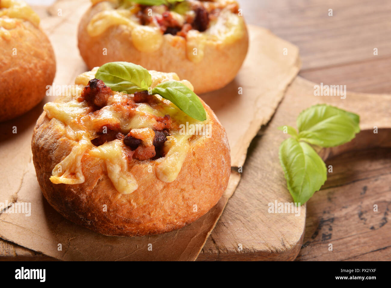 Roasted buns stuffed with meat, red beans and corn Stock Photo - Alamy