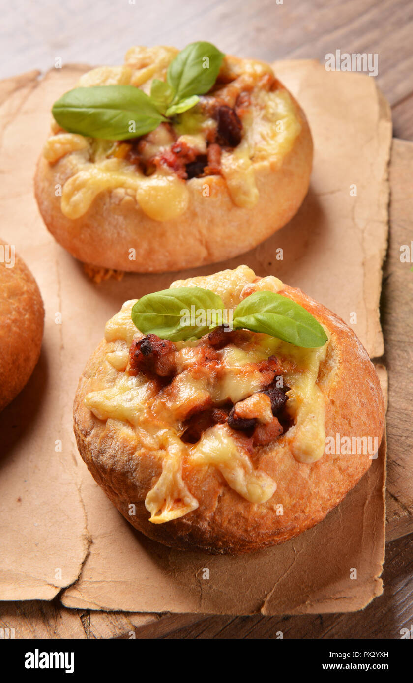 Roasted buns stuffed with meat, red beans and corn Stock Photo - Alamy