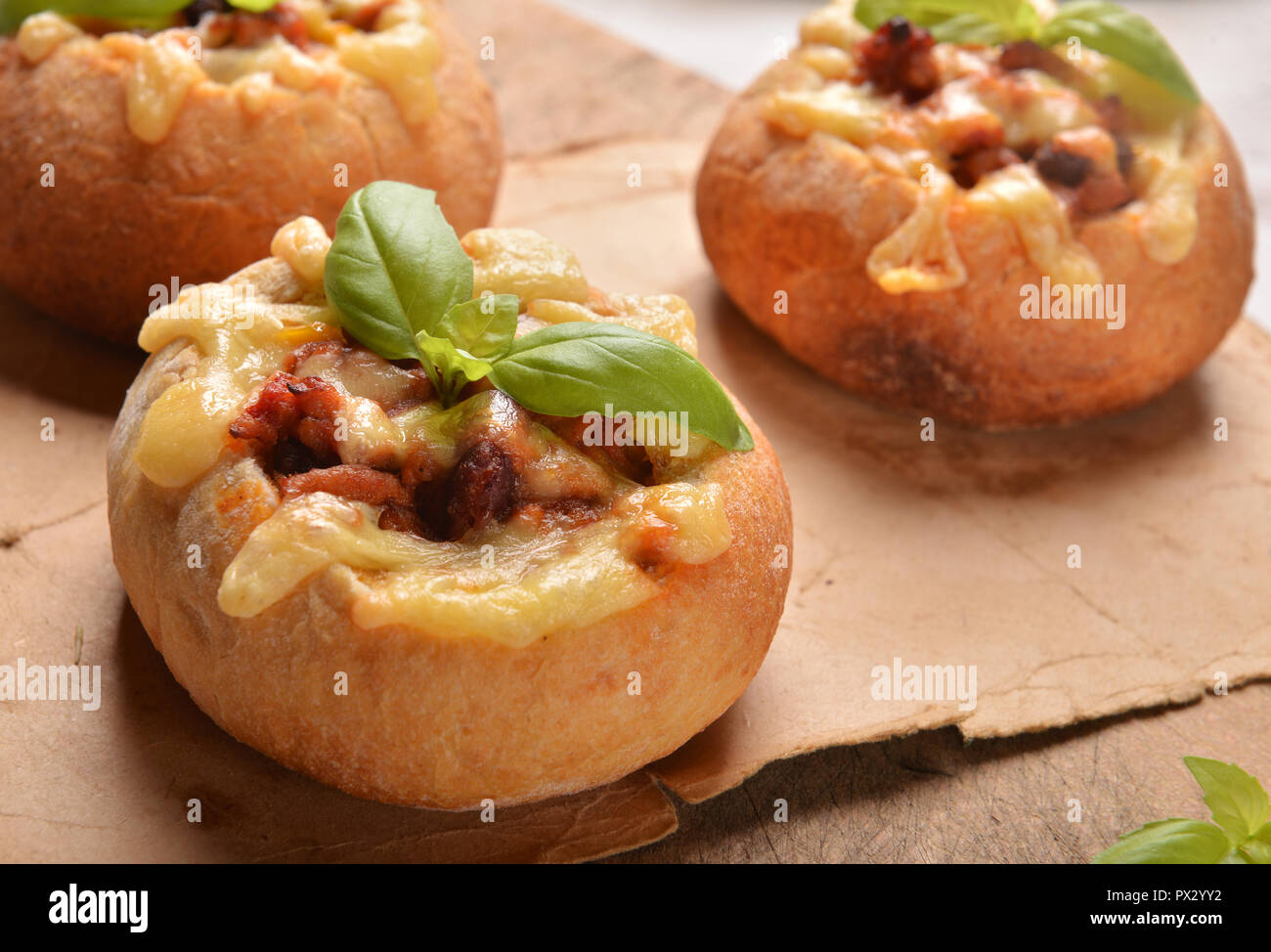 Roasted buns stuffed with meat, red beans and corn Stock Photo - Alamy