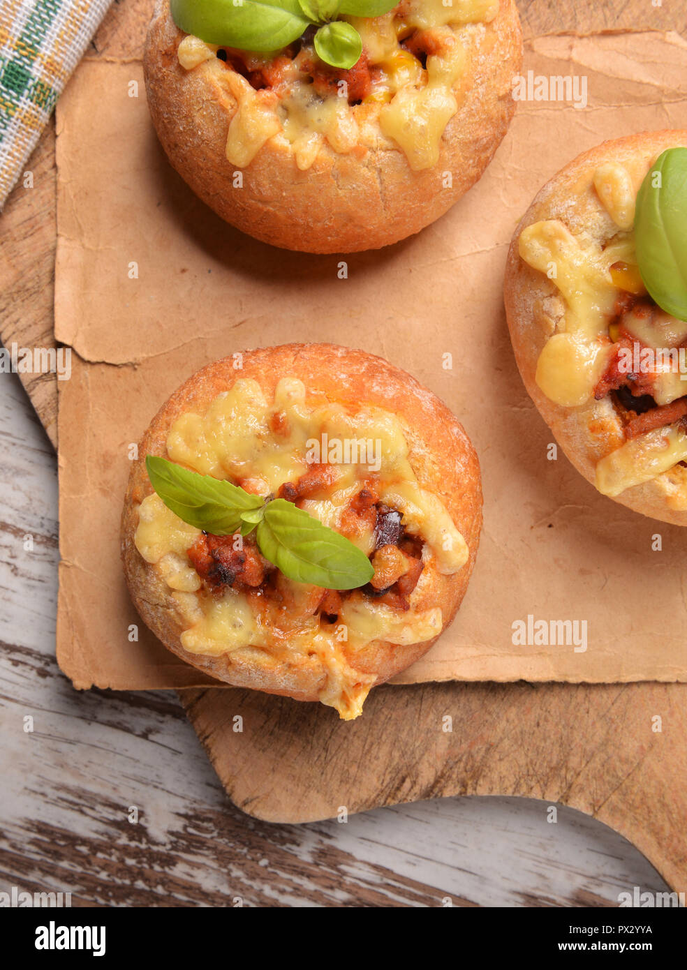 Roasted buns stuffed with meat, red beans and corn Stock Photo - Alamy