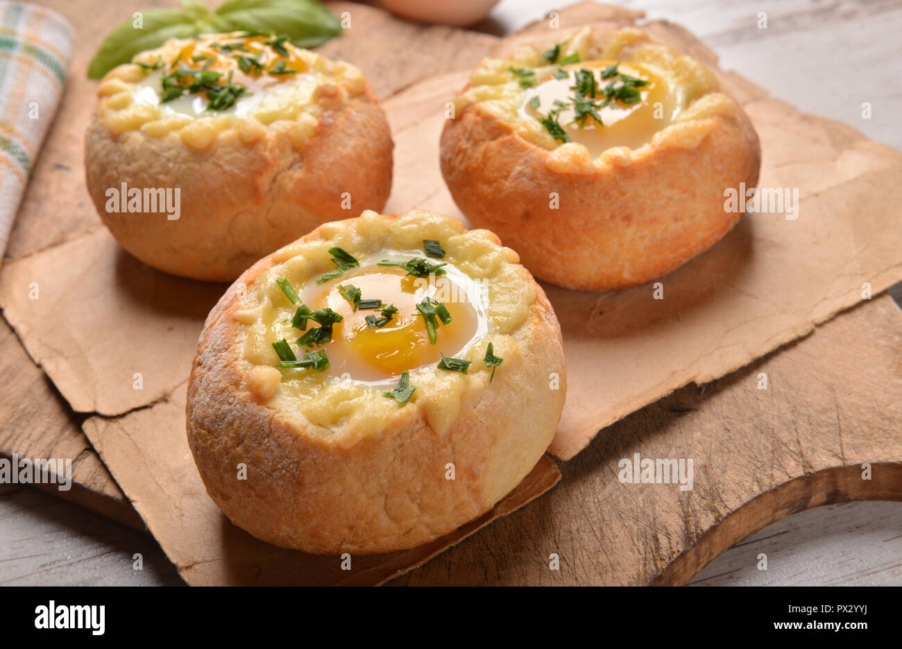 Roasted buns stuffed with eggs and bacon Stock Photo - Alamy