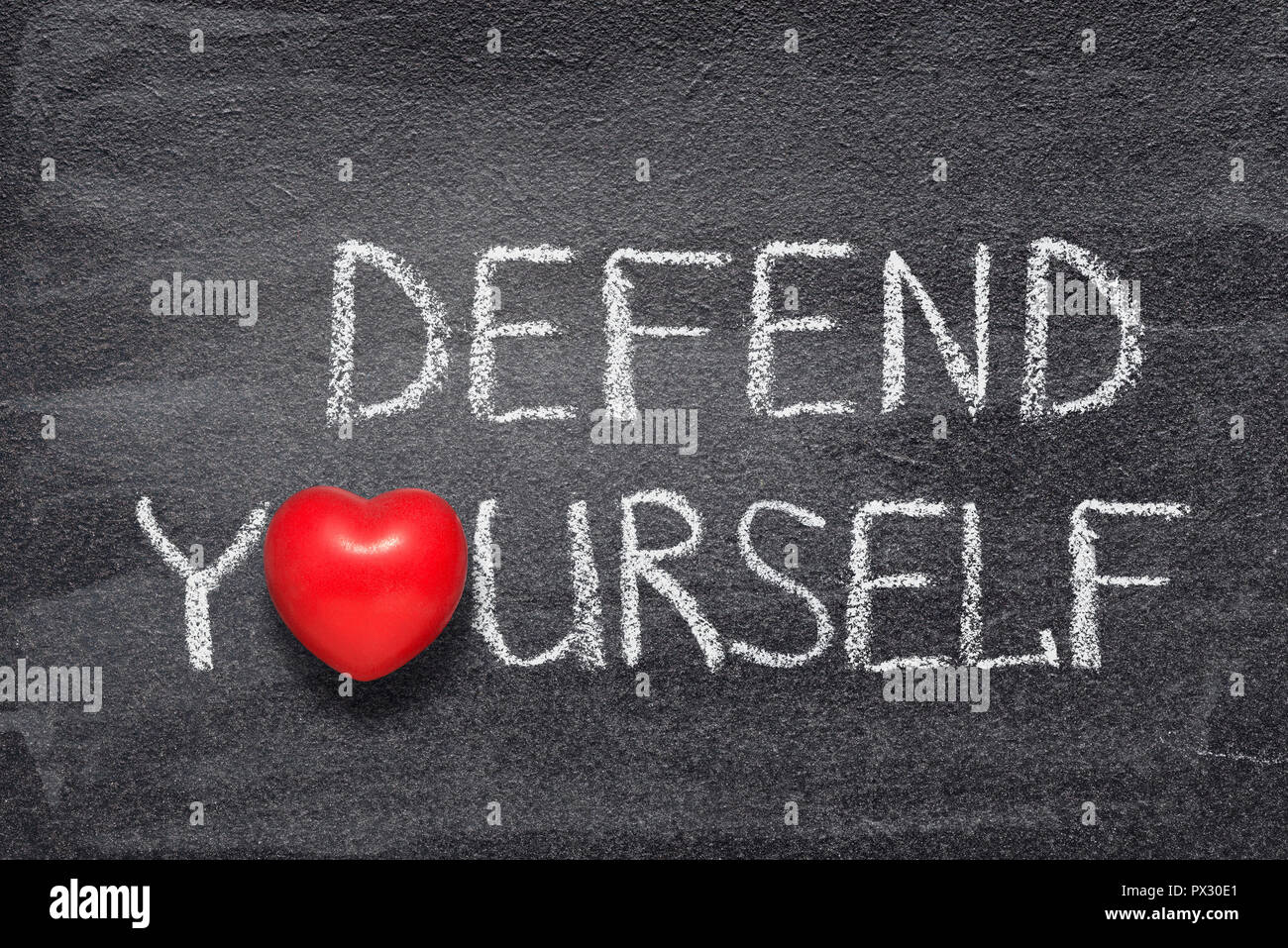 defend yourself phrase handwritten on chalkboard with red heart symbol ...