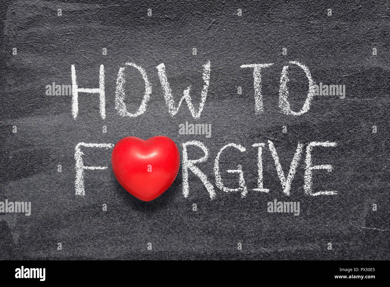 how to forgive phrase handwritten on chalkboard with red heart symbol ...