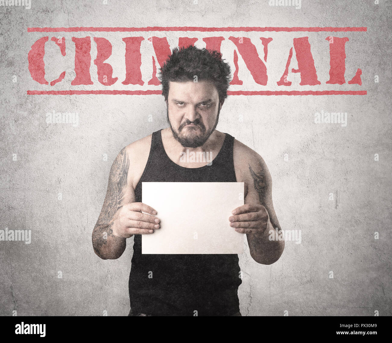Caught gangster with criminal background Stock Photo - Alamy