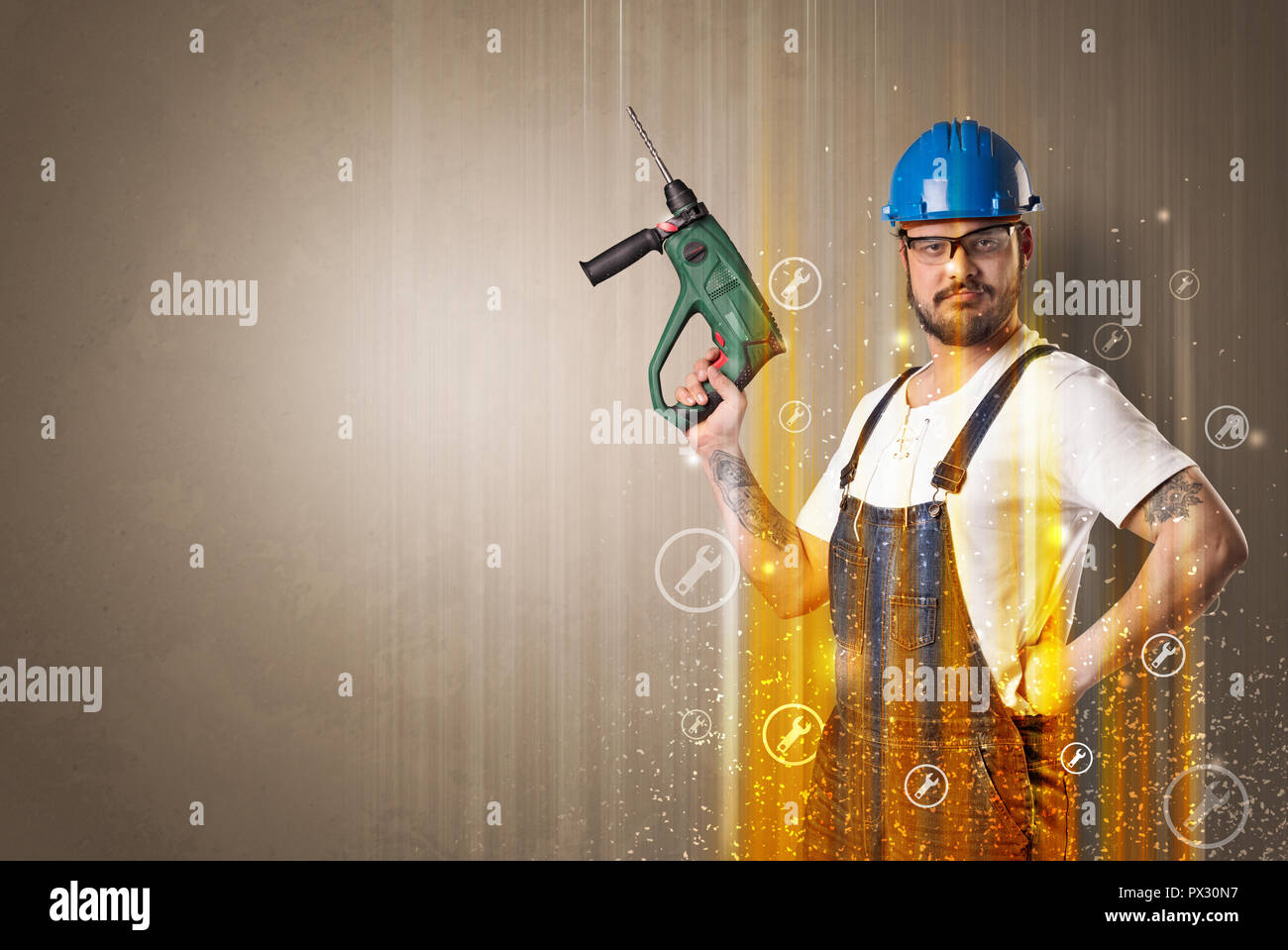 Manual worker with wrench symbols and tool Stock Photo - Alamy
