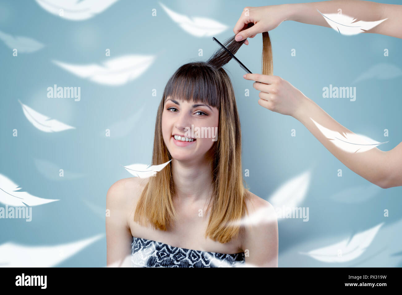 Pretty brunette woman at salon with plume around and ethereal concept ...
