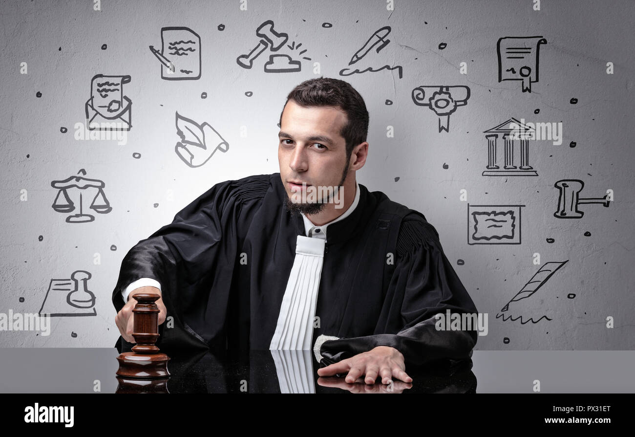 Handsome judge with court symbols around Stock Photo - Alamy