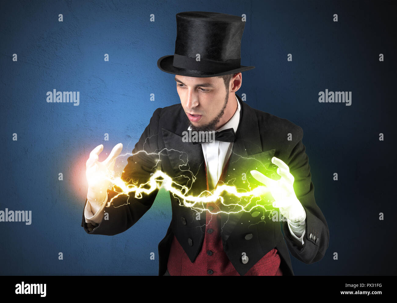 Magician sparkling super power between his two hands Stock Photo - Alamy