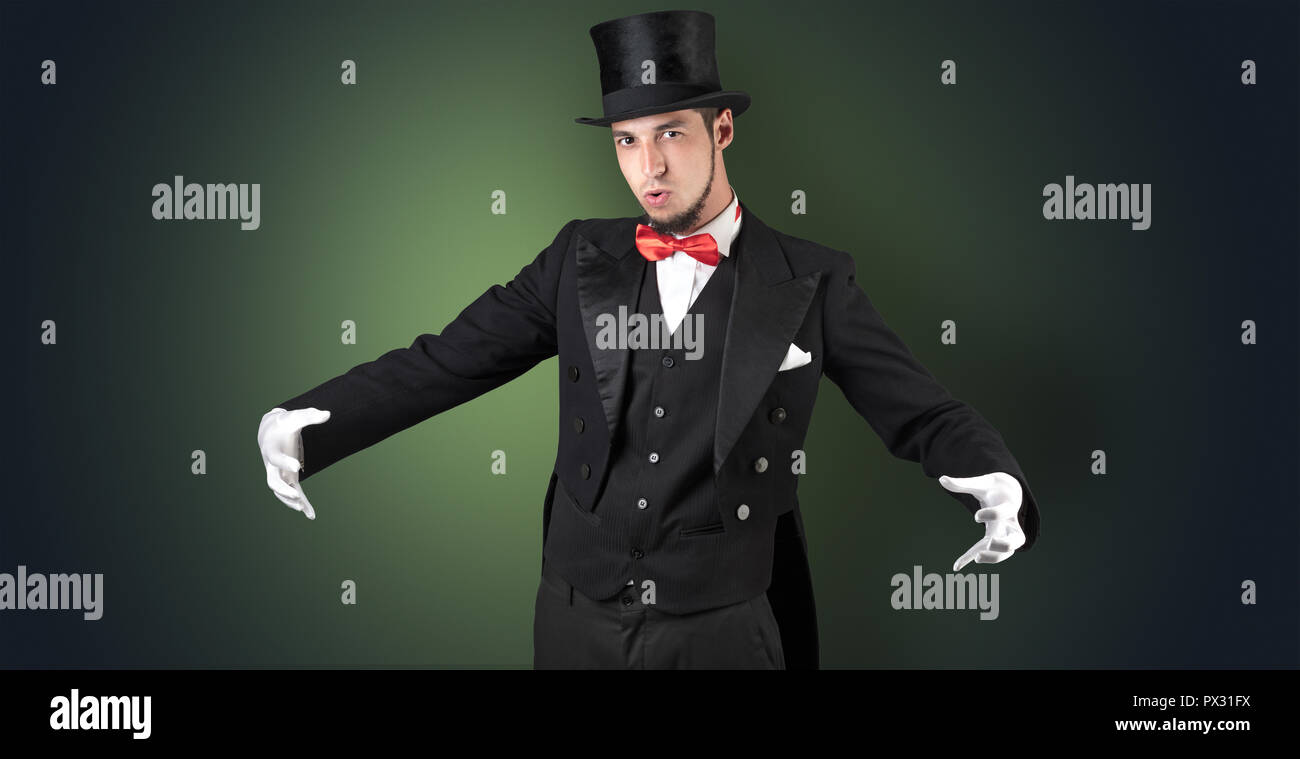 Handsome magician with no graph holds something invisible Stock Photo ...