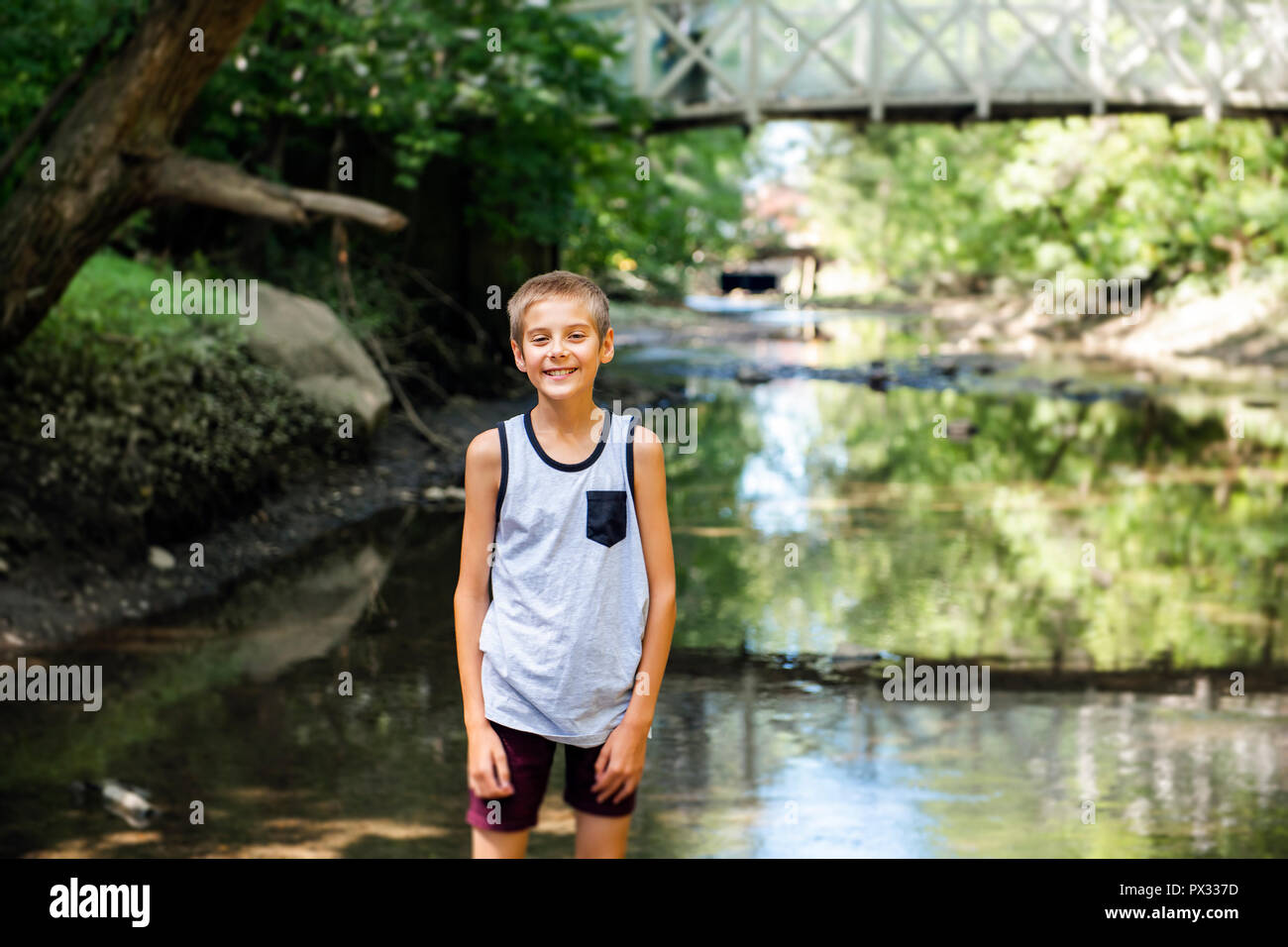 A cute boy portrait in the forest Stock Photo - Alamy