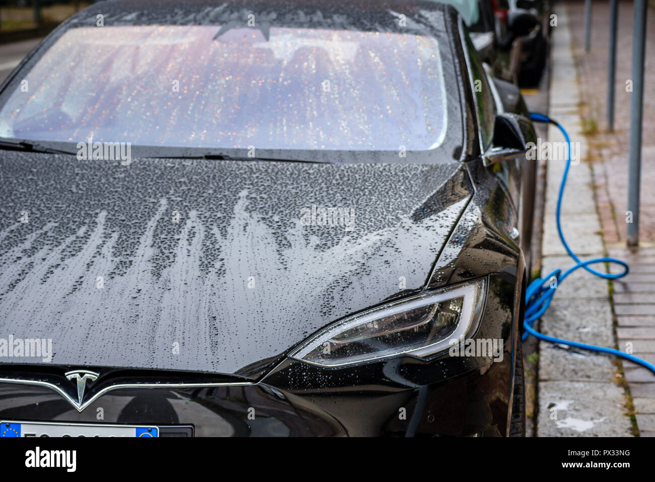 BOLOGNA, ITALY - OCTOBER 17, 2018: raindrops wetting TESLA model S car ...