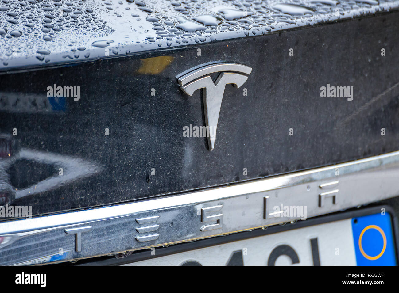 BOLOGNA, ITALY - OCTOBER 17, 2018: raindrops wetting TESLA logo on car ...