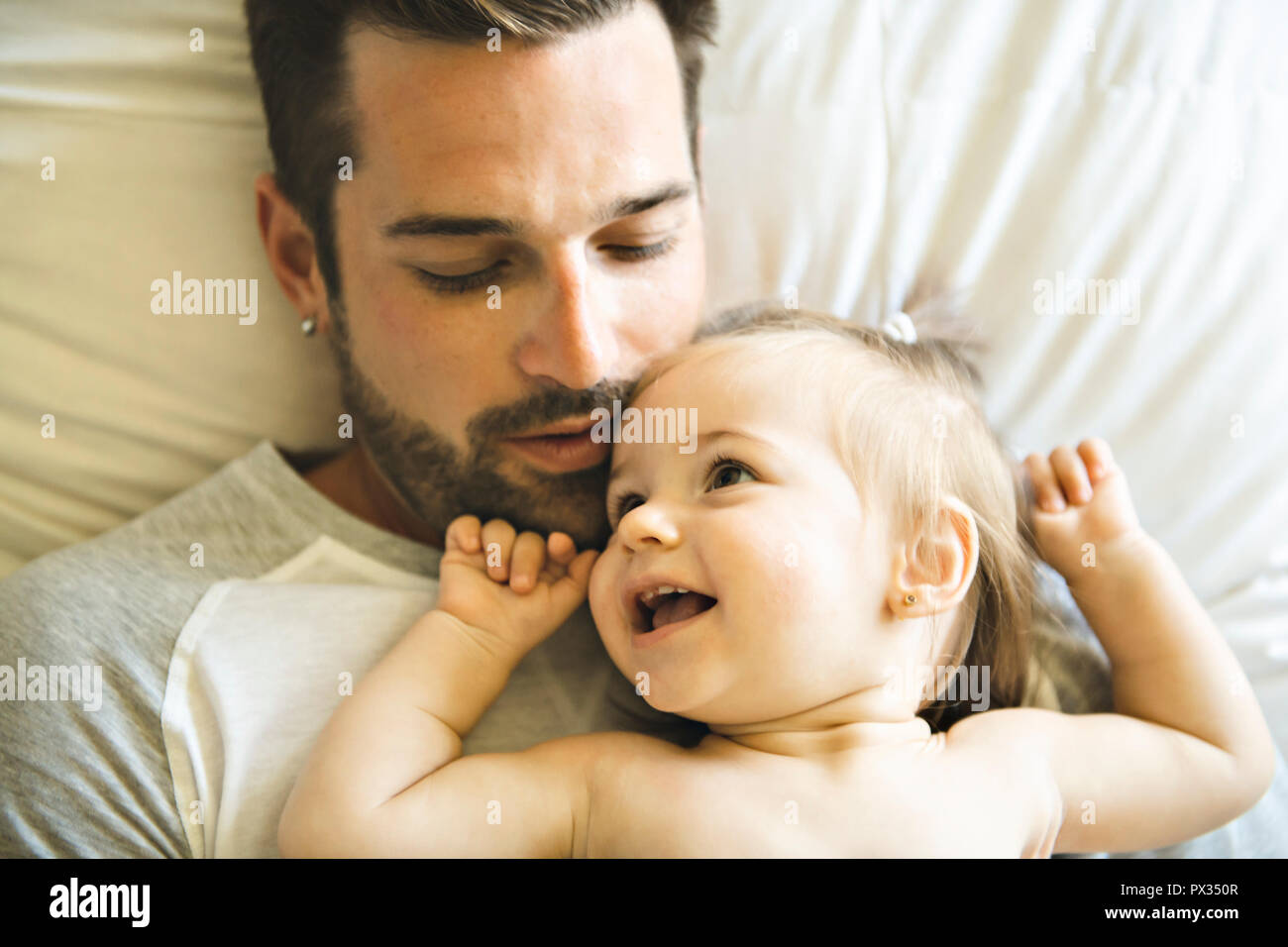 Father nursing the baby hi-res stock photography and images - Alamy