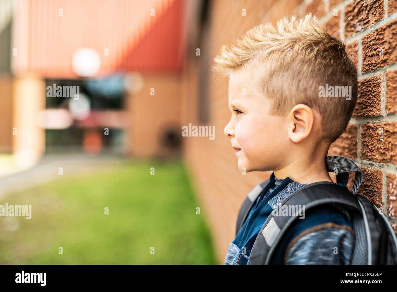 A Back to school. Happy little boy with backpack Stock Photo - Alamy