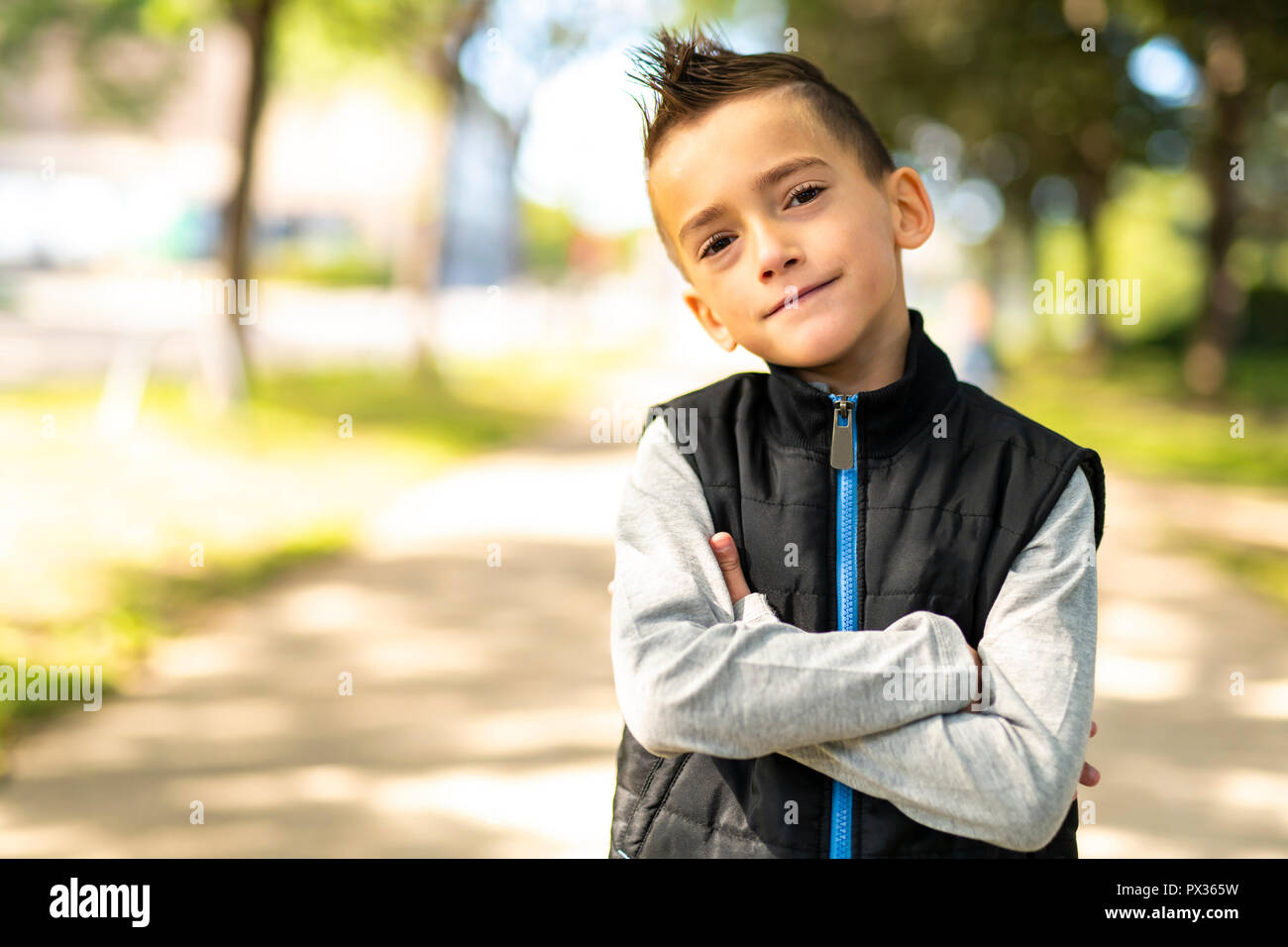 A nice boy outside posing as a model Stock Photo - Alamy