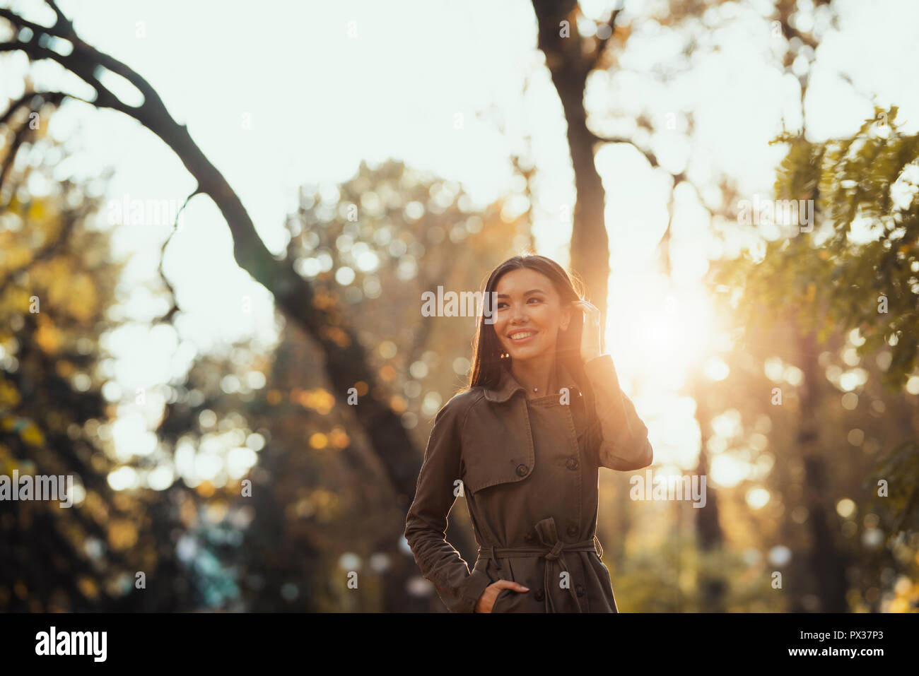 Woman during autumn, lifestyle concept. An Asian young adult female is ...