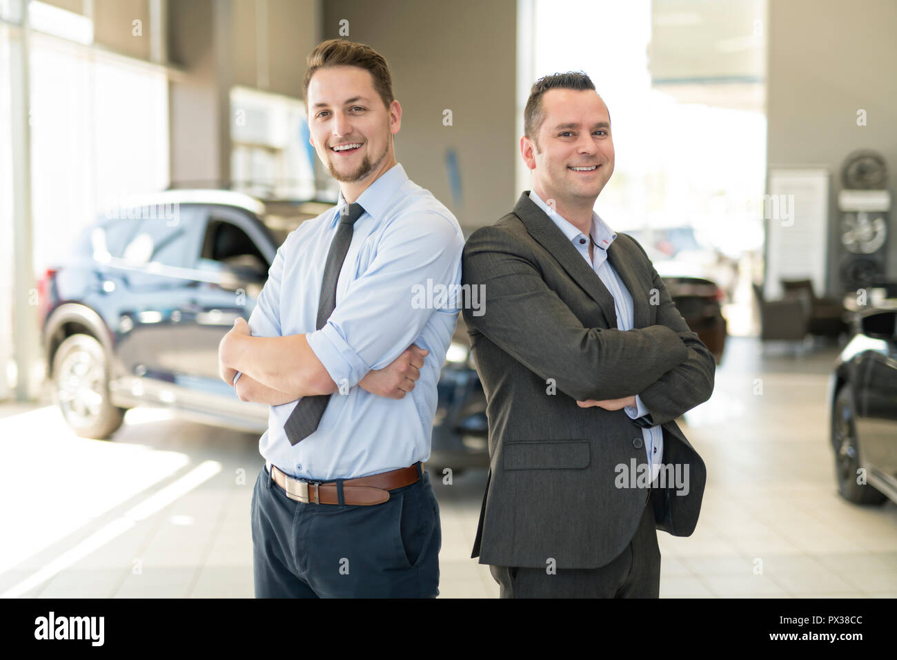 Business team car seller on the car room Stock Photo - Alamy