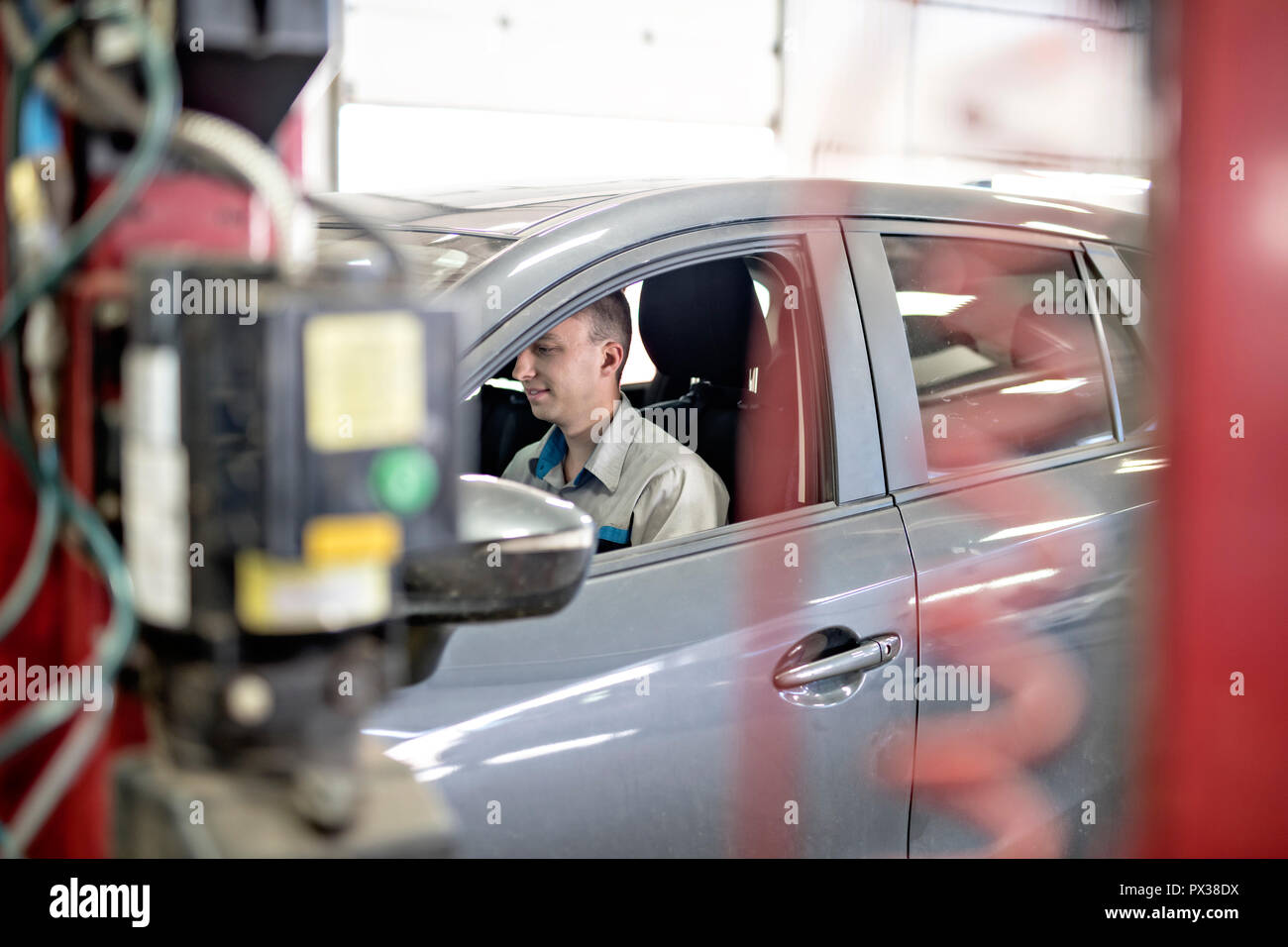 Mechanic working inside vehicle hi-res stock photography and images - Alamy