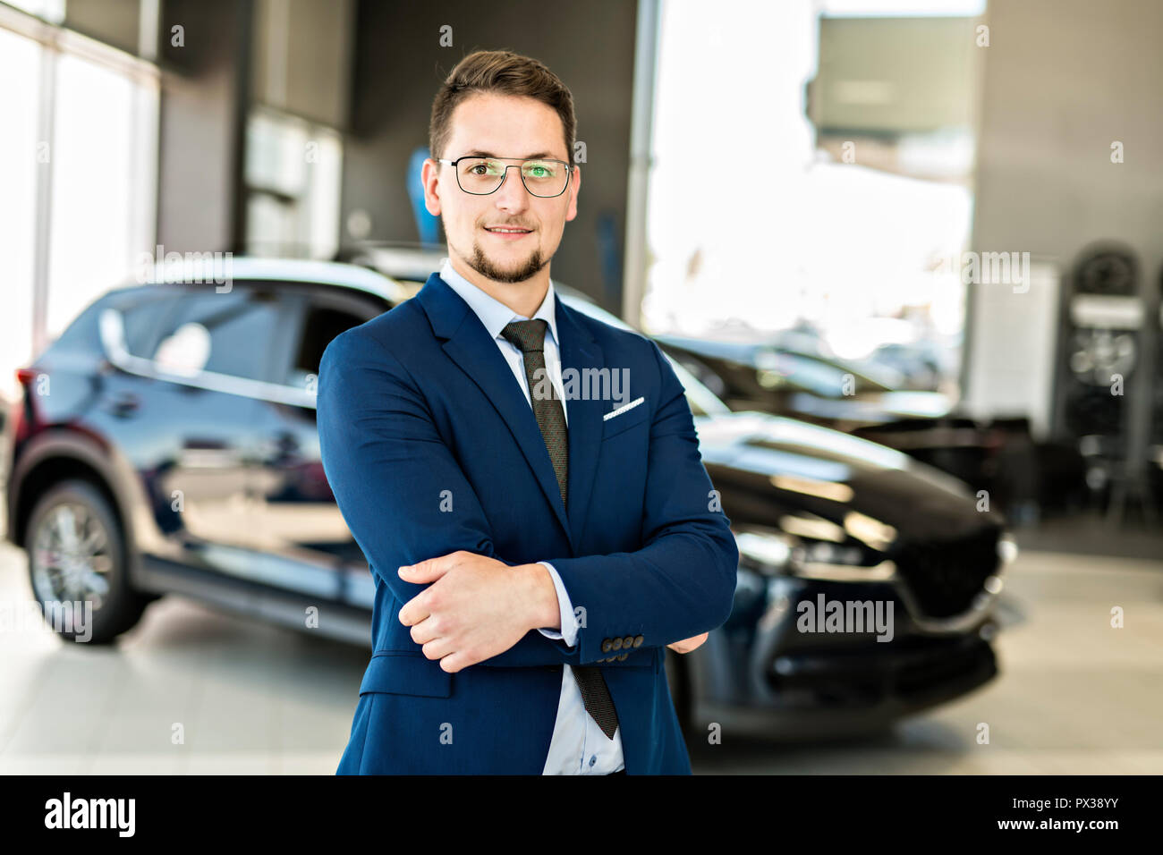 Business man working at a car dealer Stock Photo - Alamy