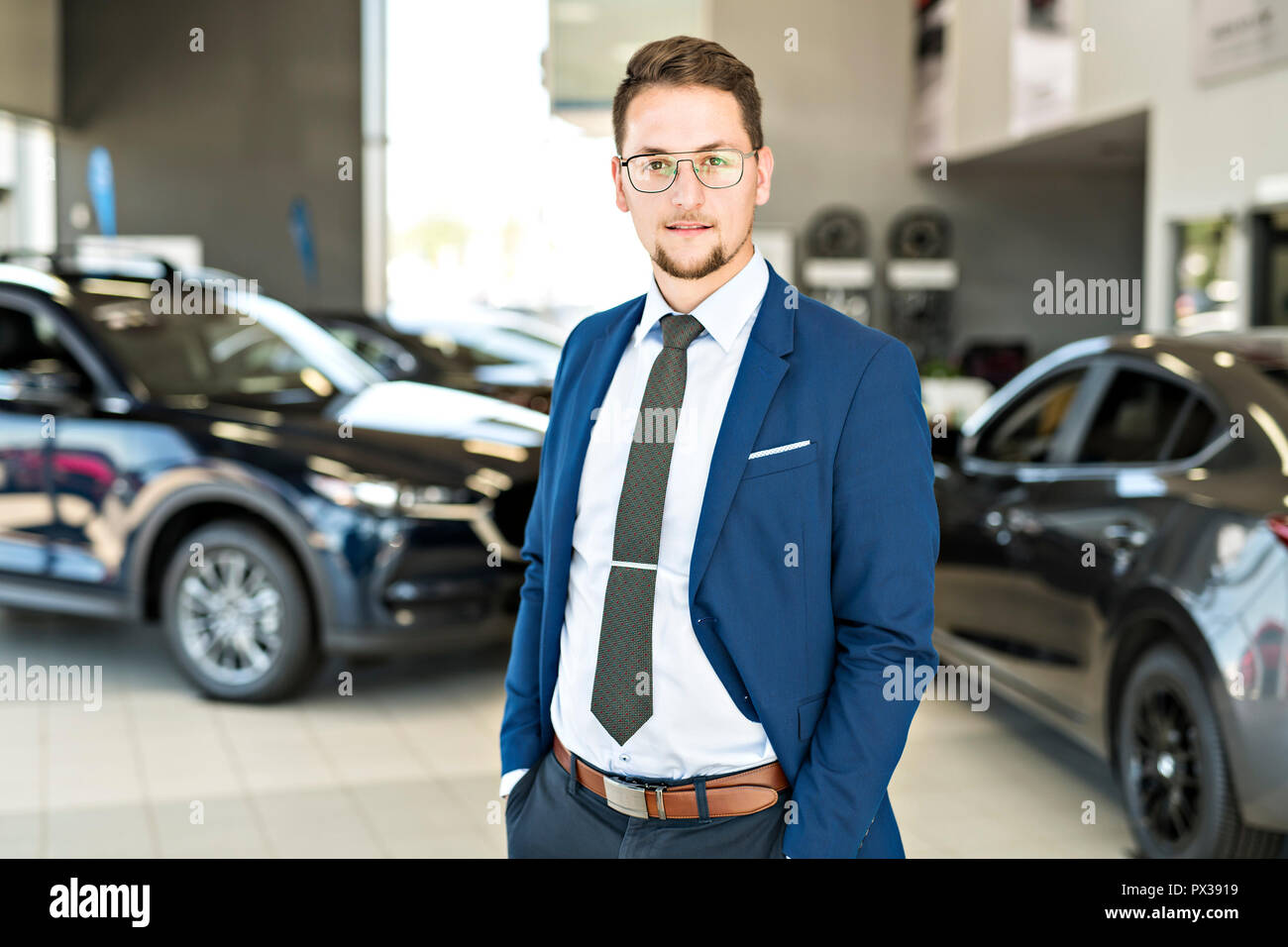 Business man working at a car dealer Stock Photo - Alamy