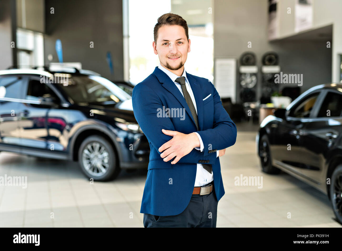 Business man working at a car dealer Stock Photo - Alamy