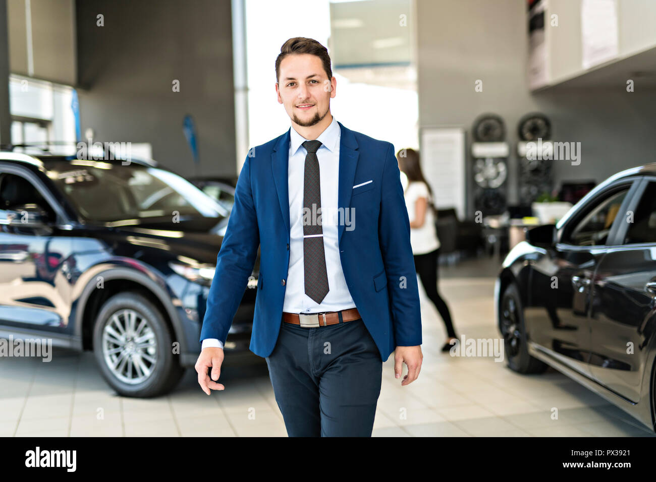Business man working at a car dealer Stock Photo - Alamy