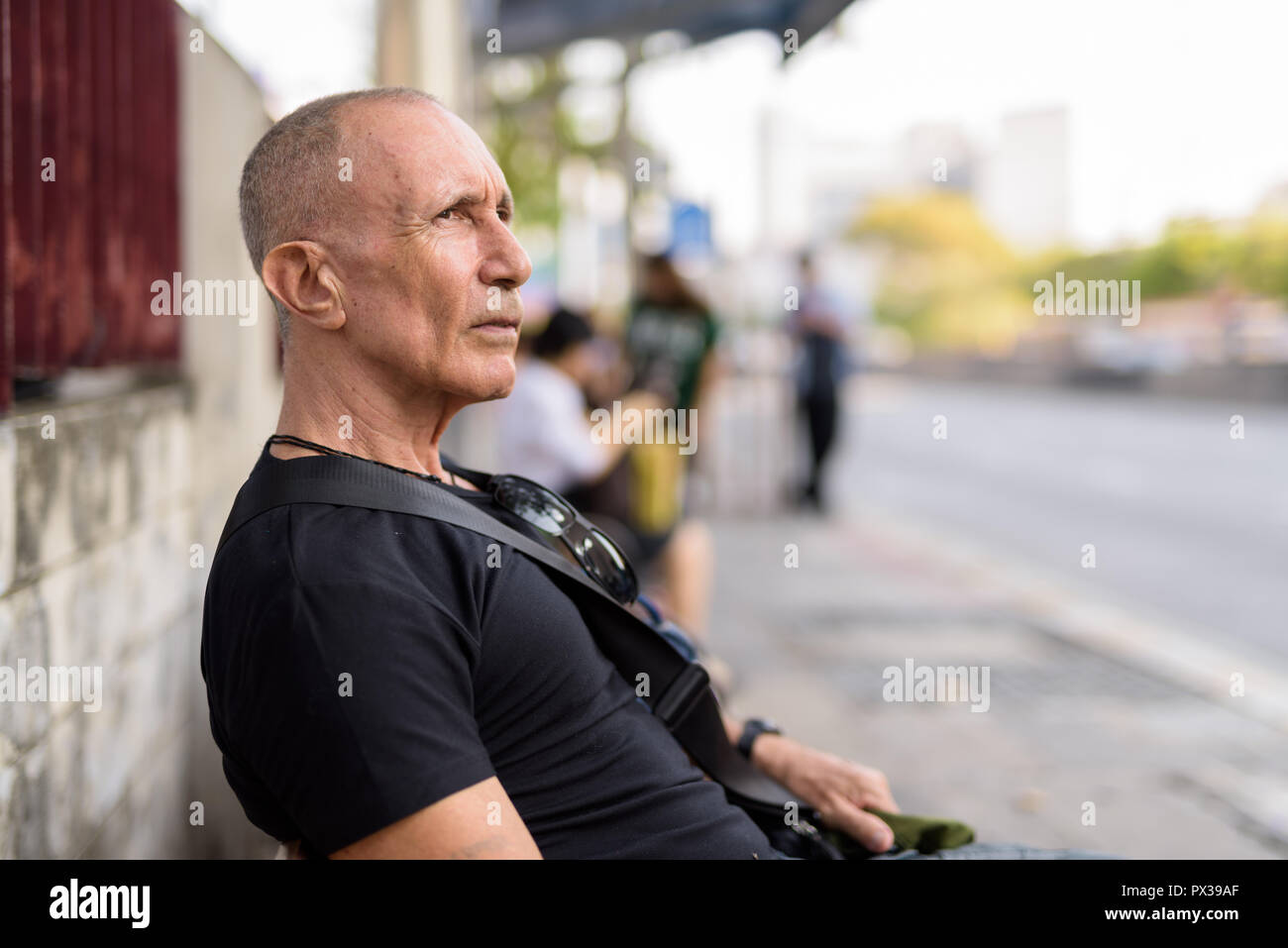 Side view man waiting bus hi-res stock photography and images - Alamy