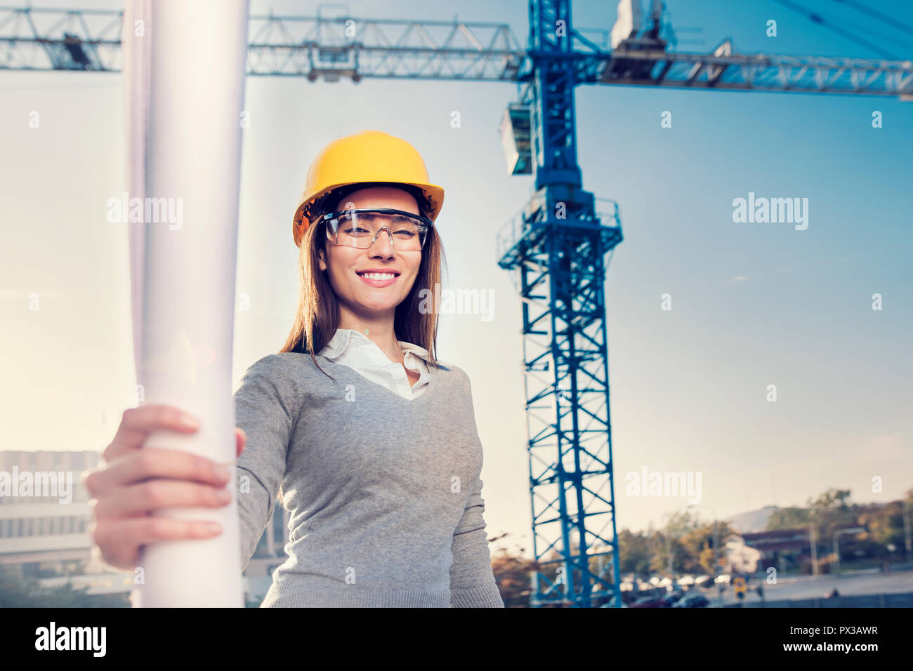 beautiful woman civil engineer smiling with confidence in front of a ...