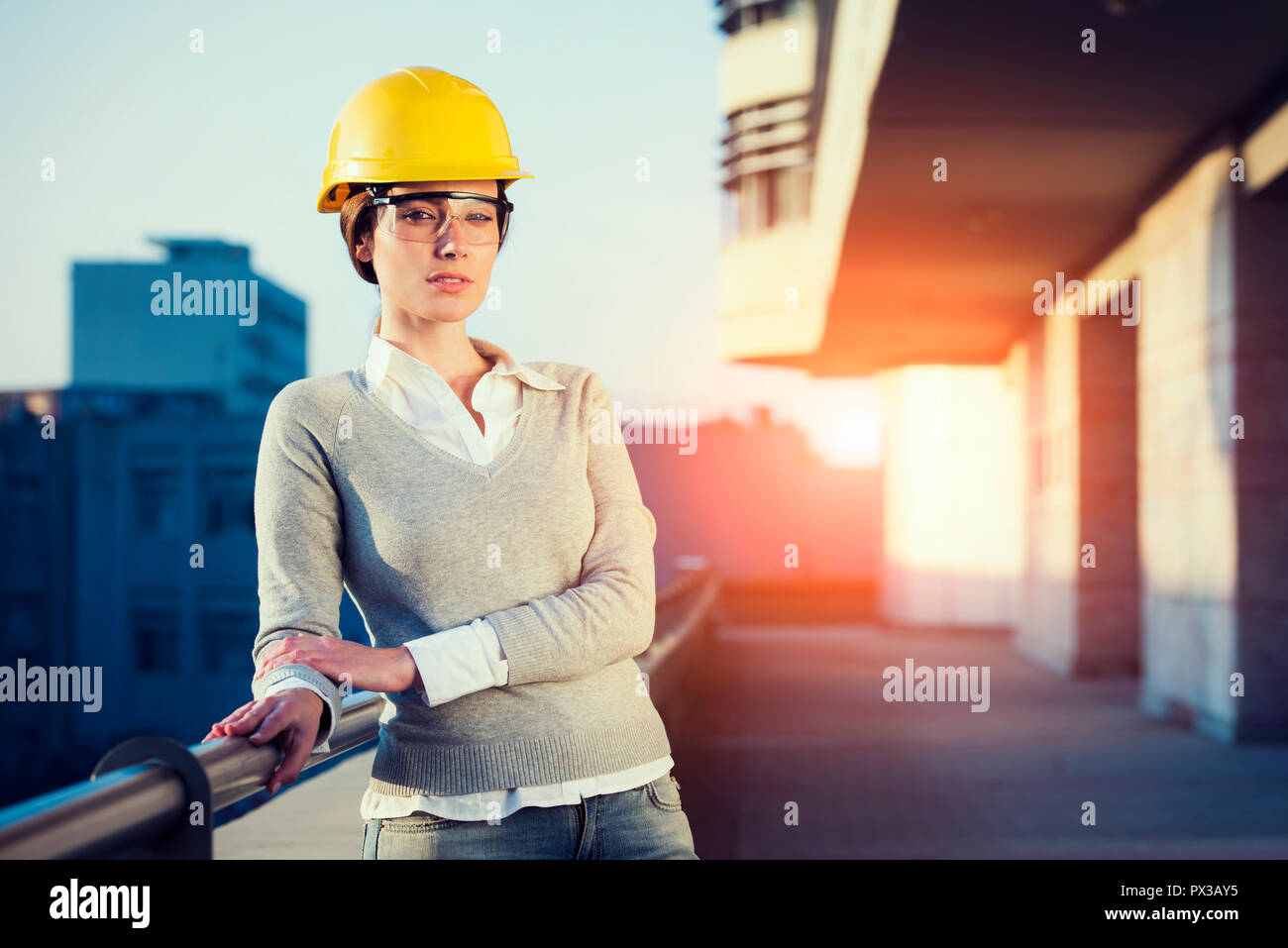 Beautiful woman engineer poses for a professional portrait in front of ...