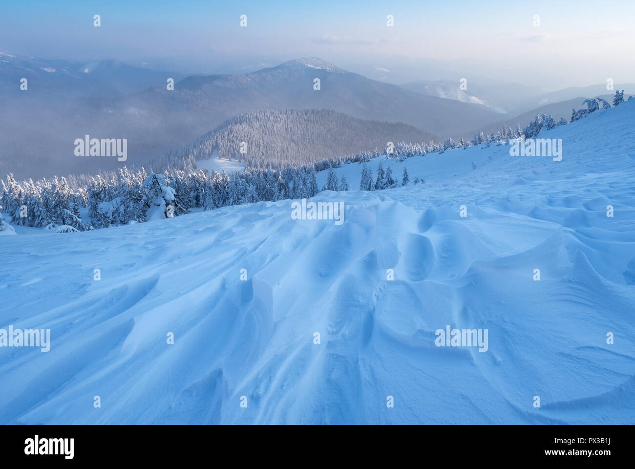 Severe winter landscape. Snow blowing in the mountains. Severe weather ...