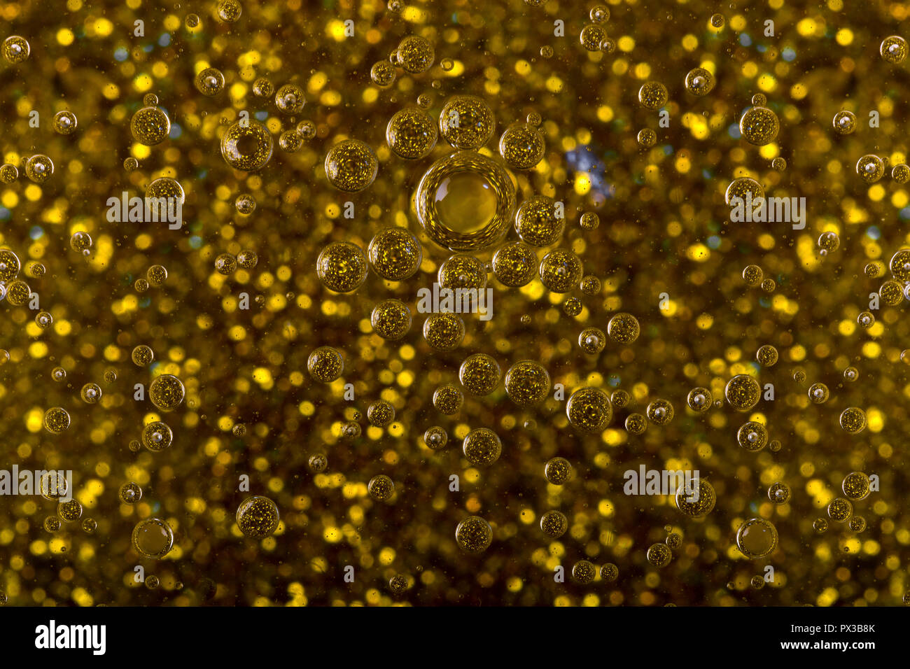 texture of bubbles on a golden shiny background Stock Photo - Alamy