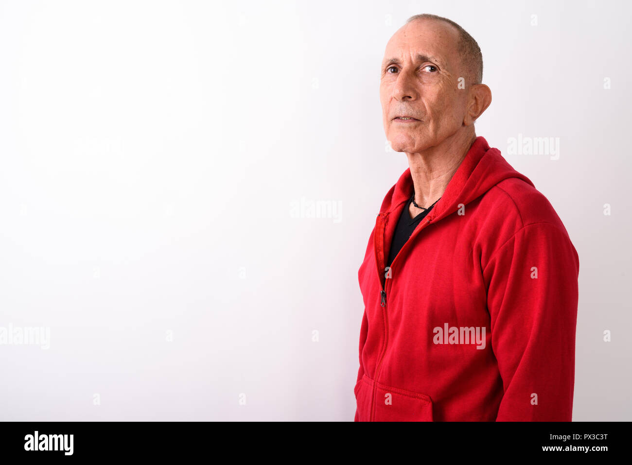 Bald senior man standing against white background Stock Photo - Alamy