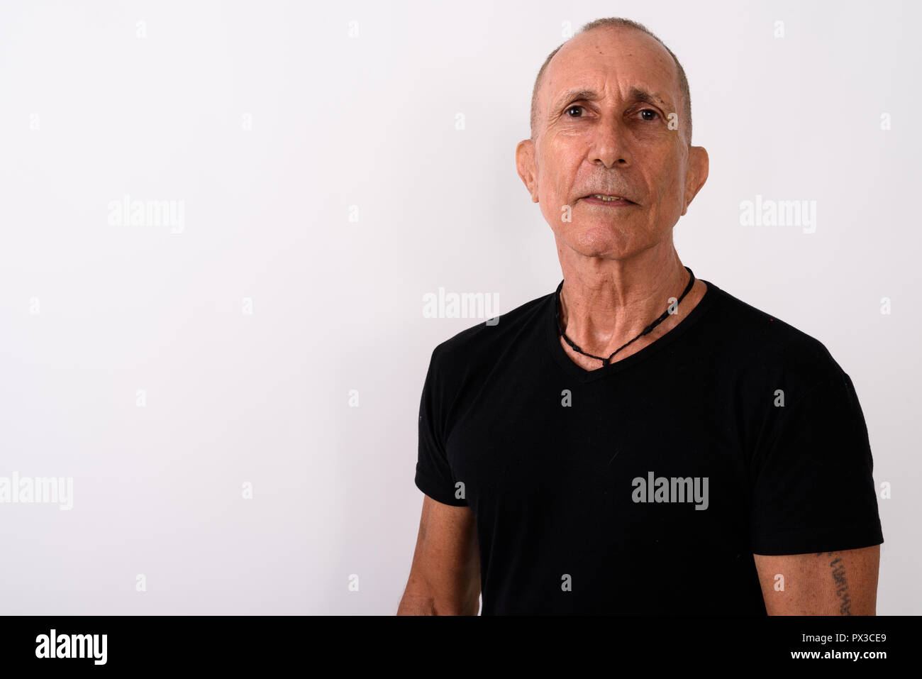 Bald senior man standing against white background Stock Photo - Alamy