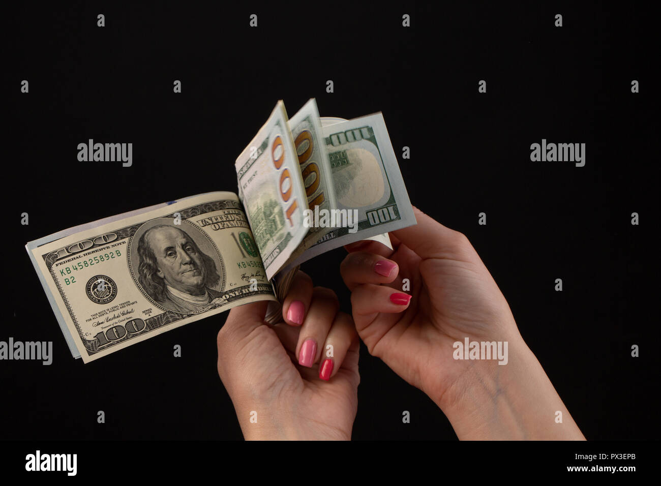 Hand giving money, United States Dollars or USD. Hands holding ...