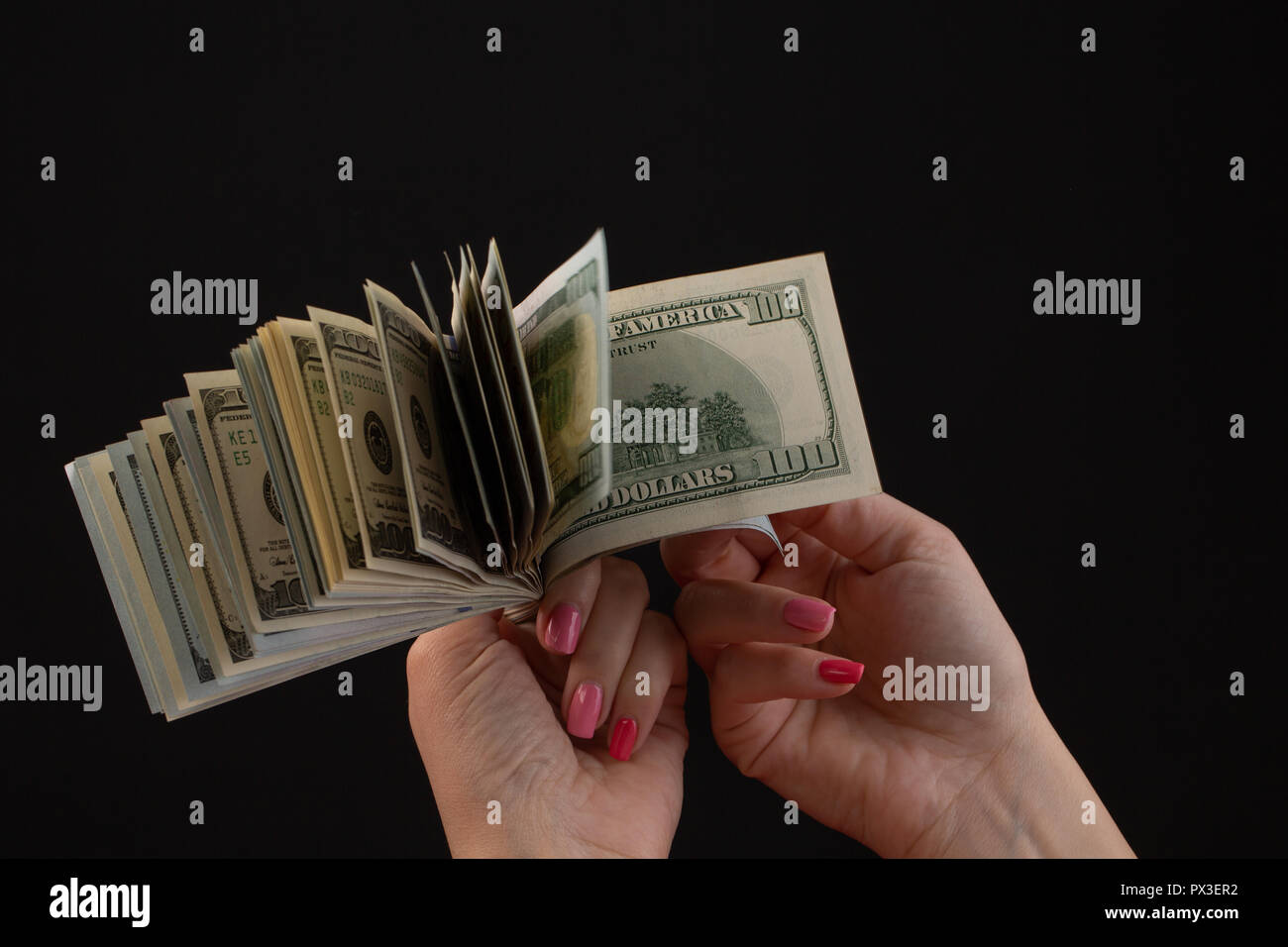 Hand giving money, United States Dollars or USD. Hands holding ...