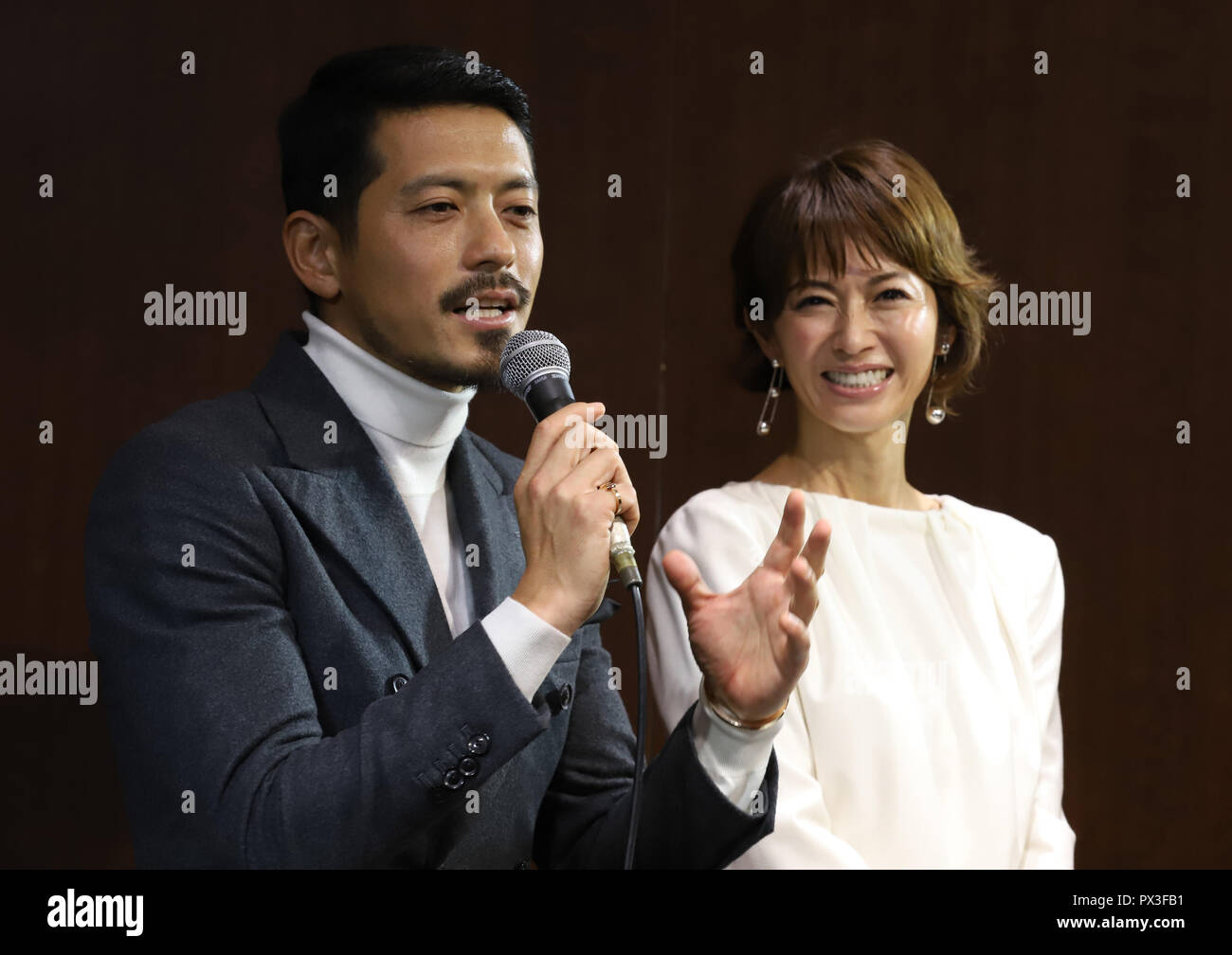 Saitama, Japan. 19th Oct, 2018. Former football player Keita Suzuki (L) and his wife Hiroko ...