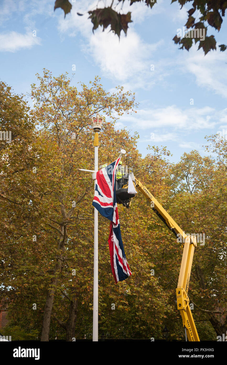 London UK. 19th October 2018. Workers on cherry pickers place Dutch and ...