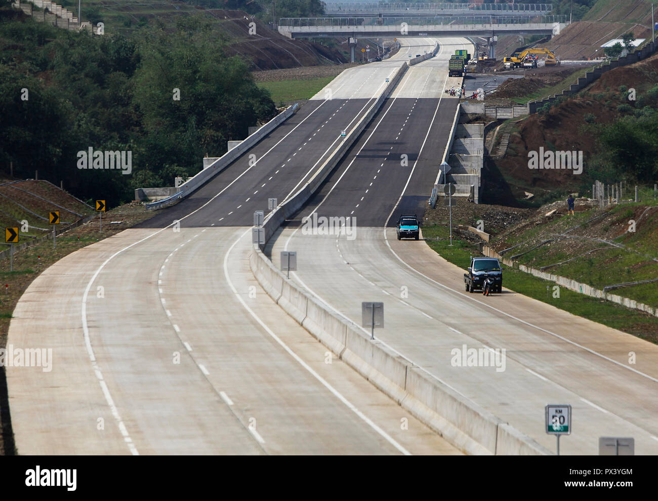 Workers complete the construction project on the Bogor-Ciawi-Sukabumi ...