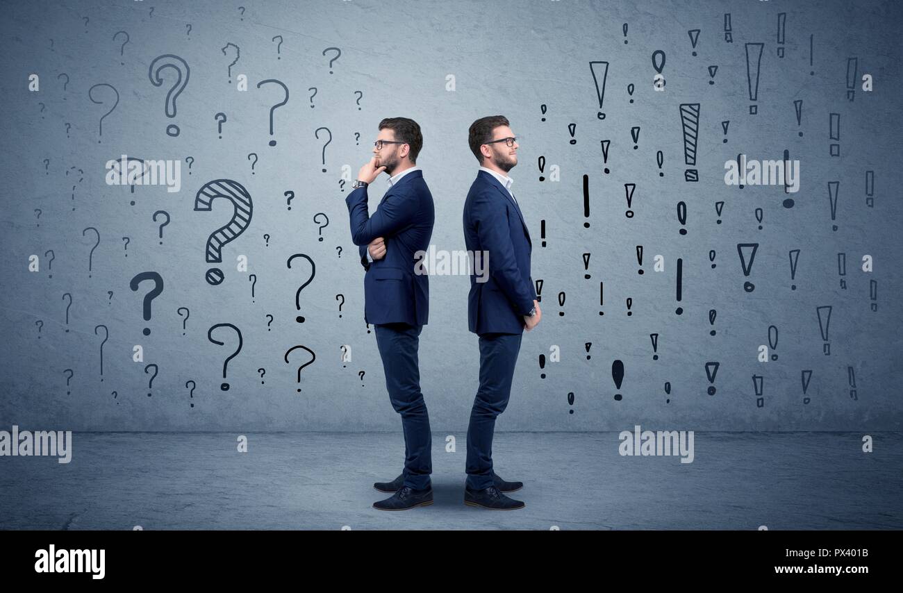 Young conflicted businessman choosing between two directions with ...