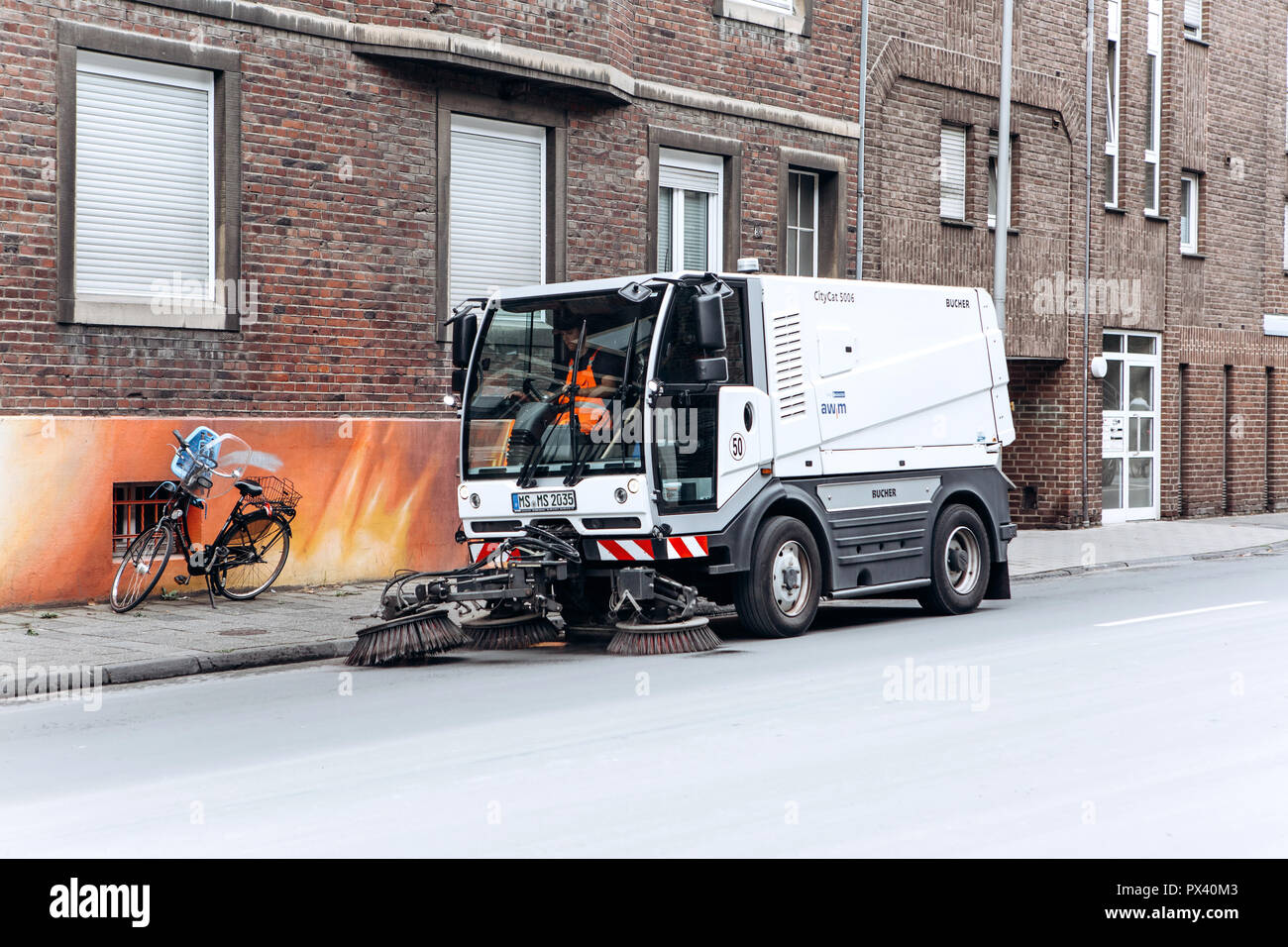 Street cleaning vehicle along a road hi-res stock photography and ...