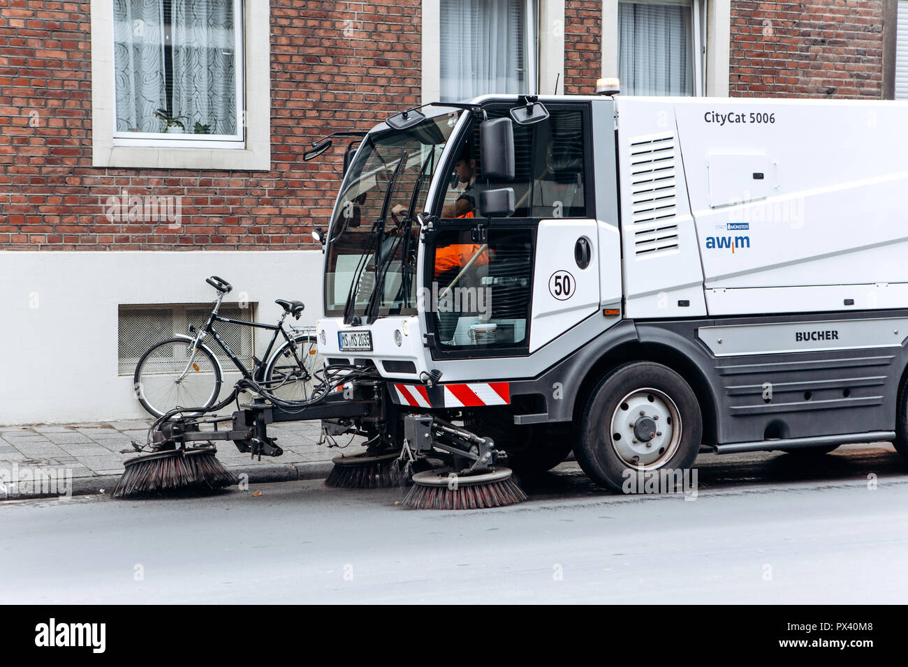 Street cleaning vehicle along a road hi-res stock photography and ...