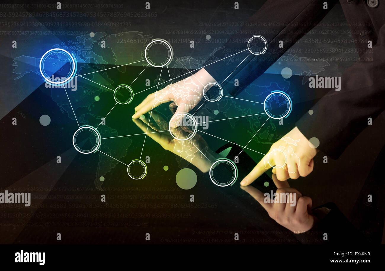 Male hands touching interactive table with colorful world map on it ...