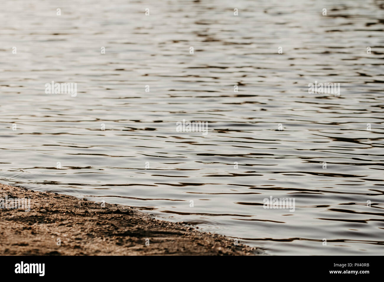 Calm water river background with reflection at sunset Stock Photo - Alamy