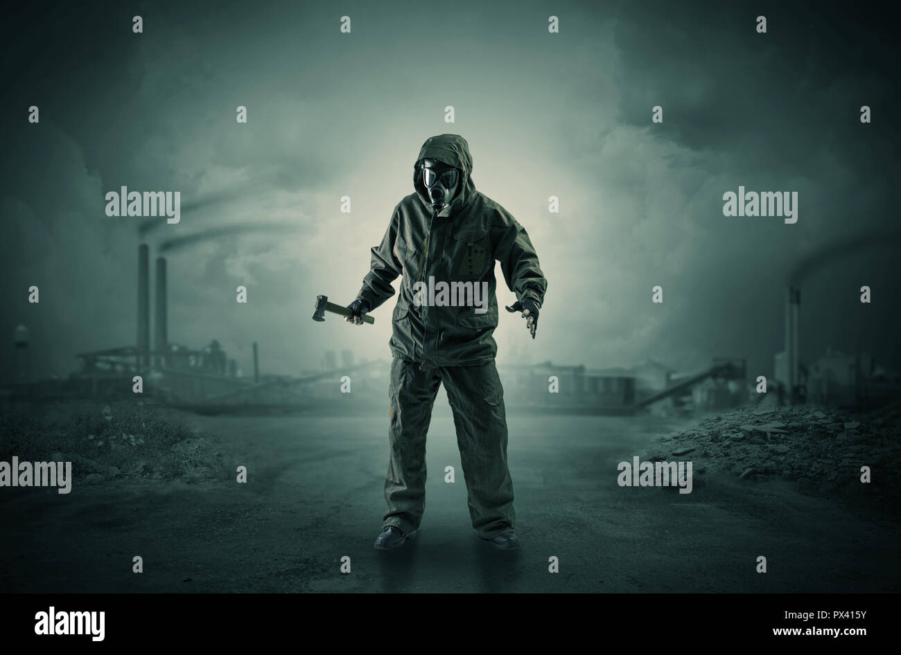 Gas masked survival man coming with arms on his hand in a demolished ...