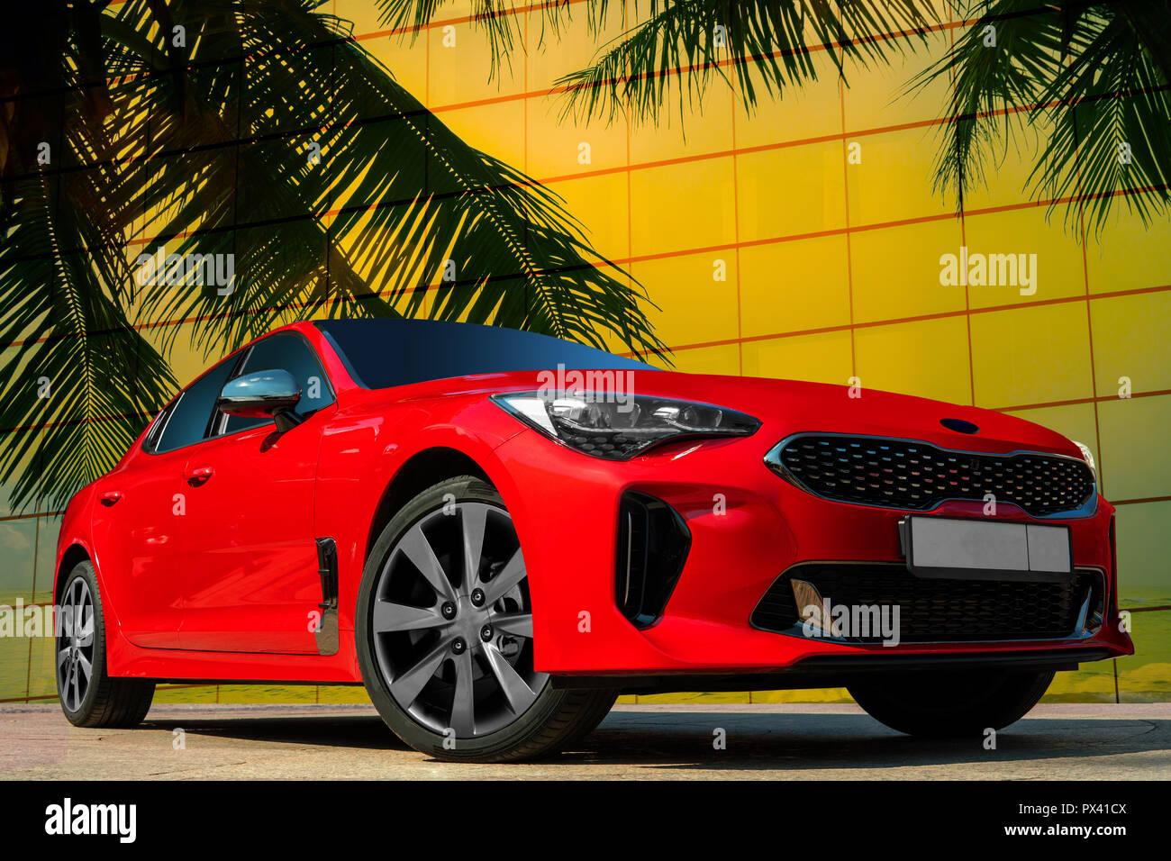 Red car on a background of palm trees. Stylish, modern, bright image of ...