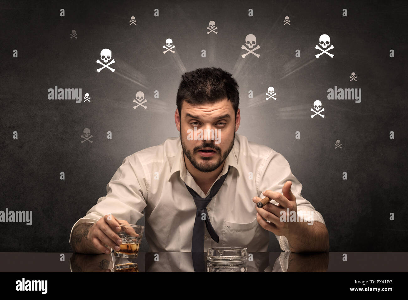 Loser drunk man sitting at table with skulls concept around Stock Photo ...