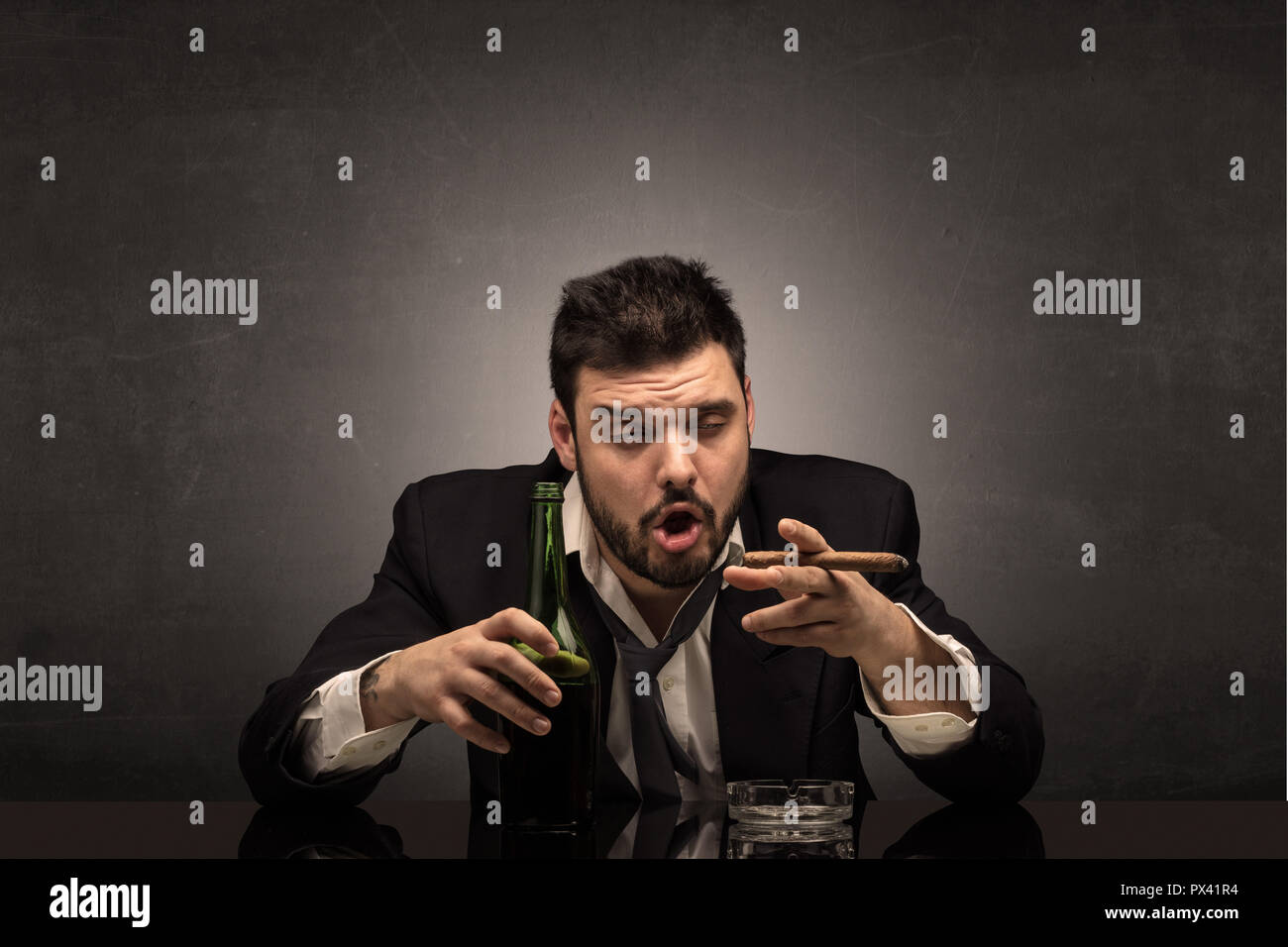 Young drunk man at his office with free dark copyspace Stock Photo - Alamy