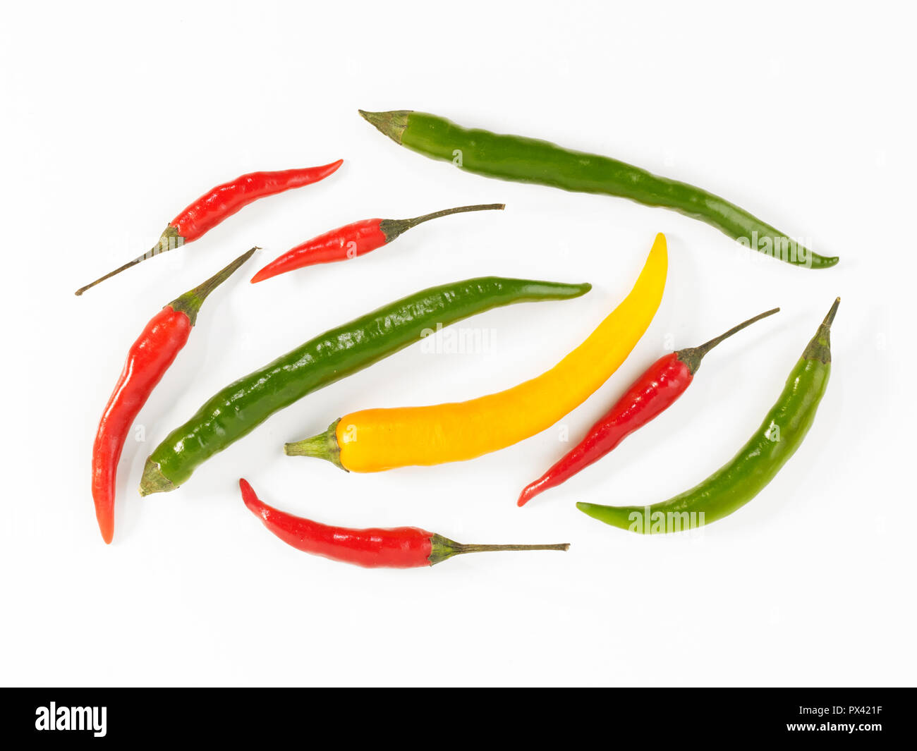 a selection of red, green and yellow assorted chilli peppers Stock ...