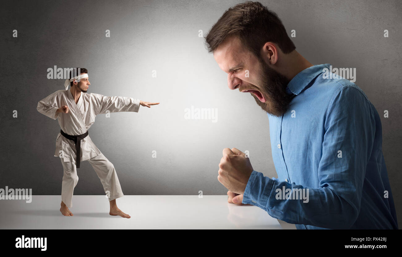 Giant hipster man yelling at a small karate man Stock Photo - Alamy