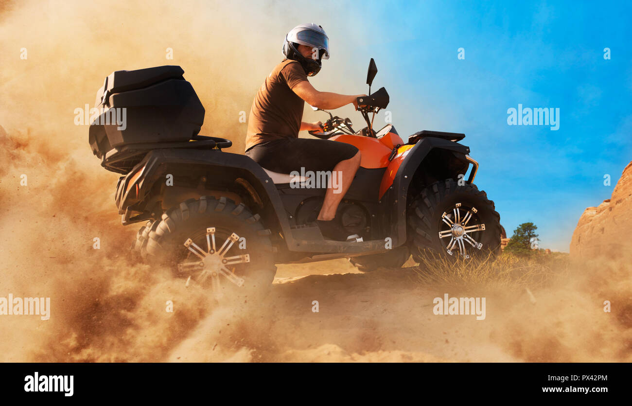 Atv in dust clouds, sand quarry on background Stock Photo - Alamy